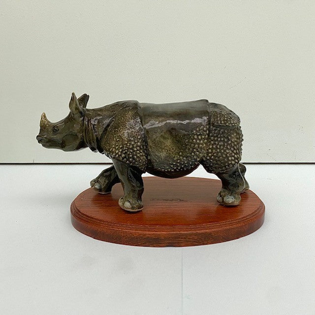 Porcelain Rhino on Wooden Plinth - At home in the country